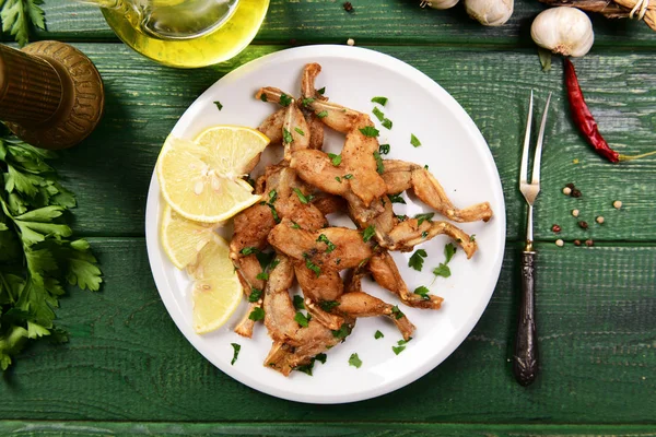 Delicious Baked Frog Legs Close — Stock Photo © kwasny222 #223009958