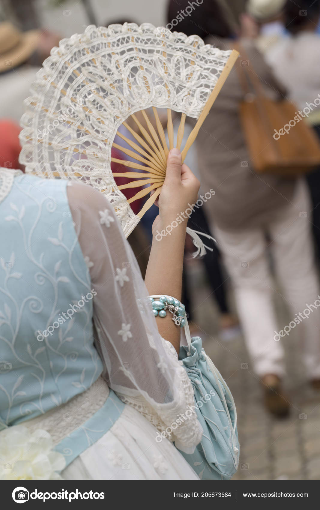Woman Using Fan — Stock Photo © paulasierra #205673584