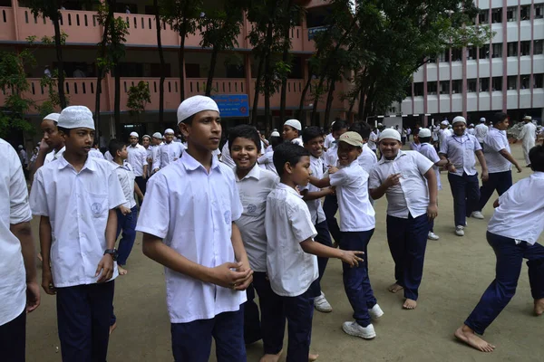 Indian middle school boys dressed up as girls in white and gray school ...