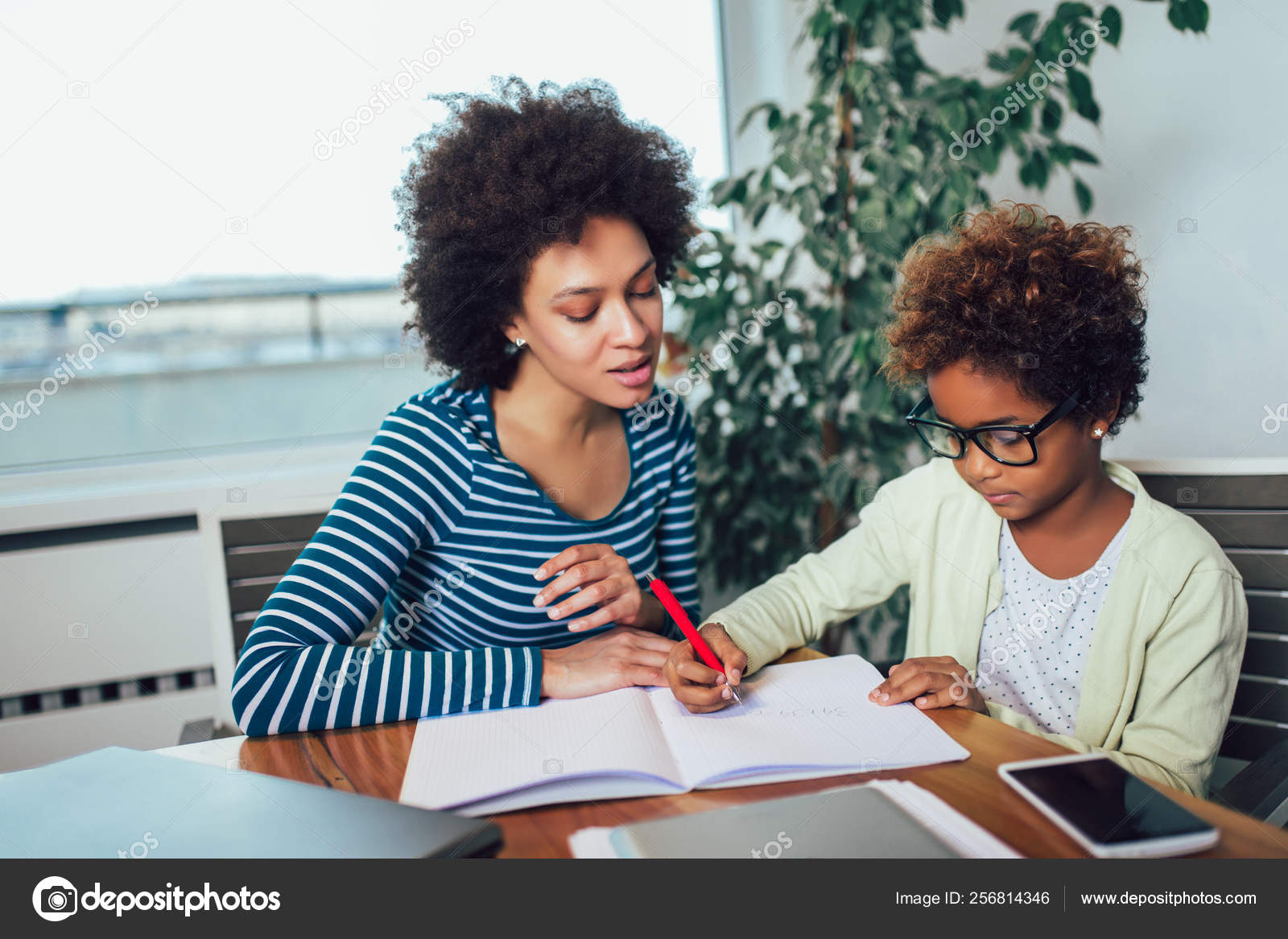 Mother and daughter doing homework learning to calculate — Stock Photo ...
