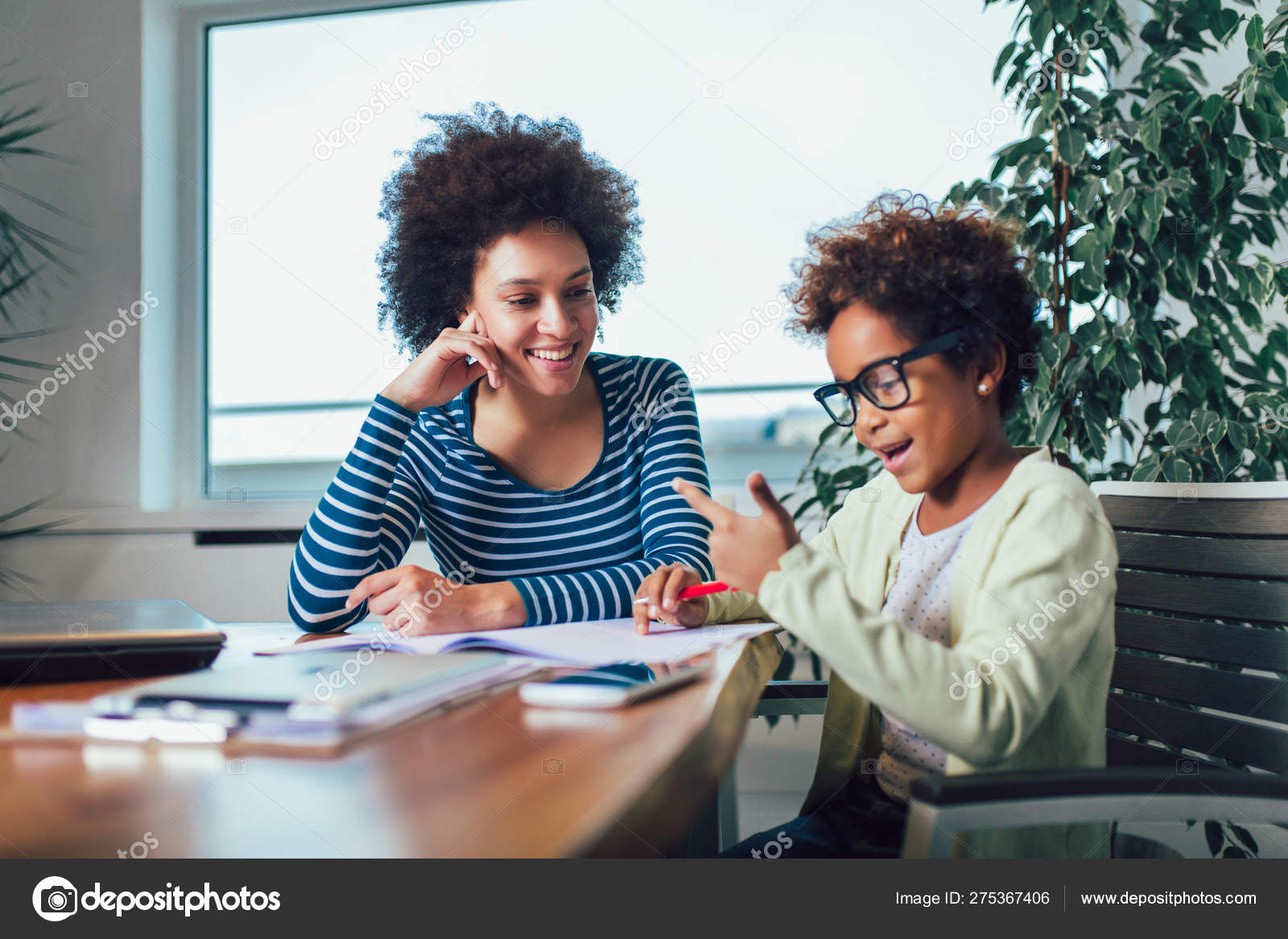 Mother and daughter doing homework learning to calculate — Stock Photo ...