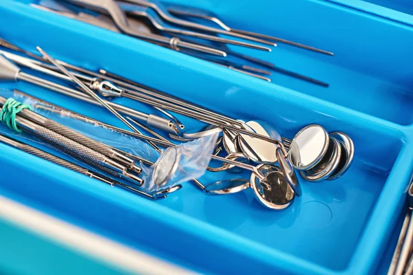 Otorhinolaryngology or ENT surgery instruments in a blue medical box ...