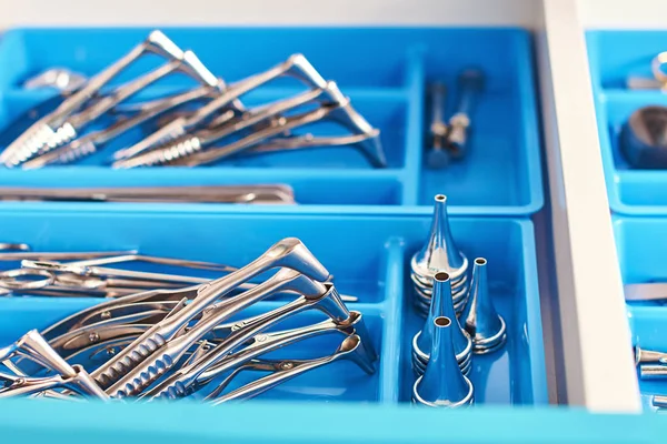 Otorhinolaryngology or ENT surgery instruments in a blue medical box ...