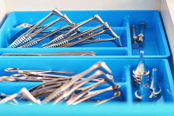 Otorhinolaryngology or ENT surgery instruments in a blue medical box ...