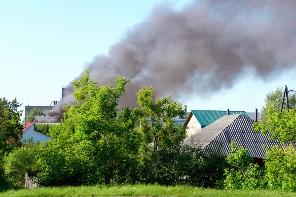 Fire everywhere and smoke in a residential area at night. Dangerous ...