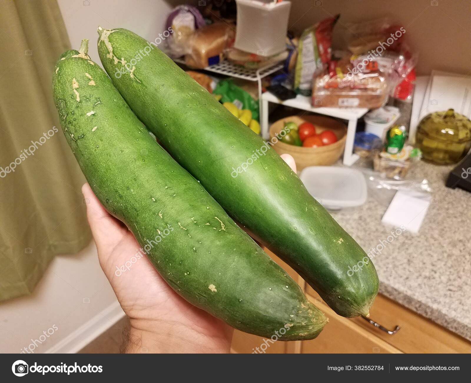 Hand Holding Large Green Cucumbers Kitchen Grey Counter — Stock Photo ...