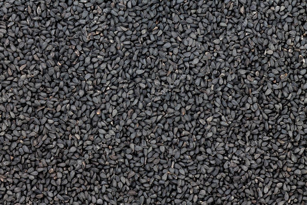 Textura culinaria de fondo de semillas negras, nigella o kalonji una ...