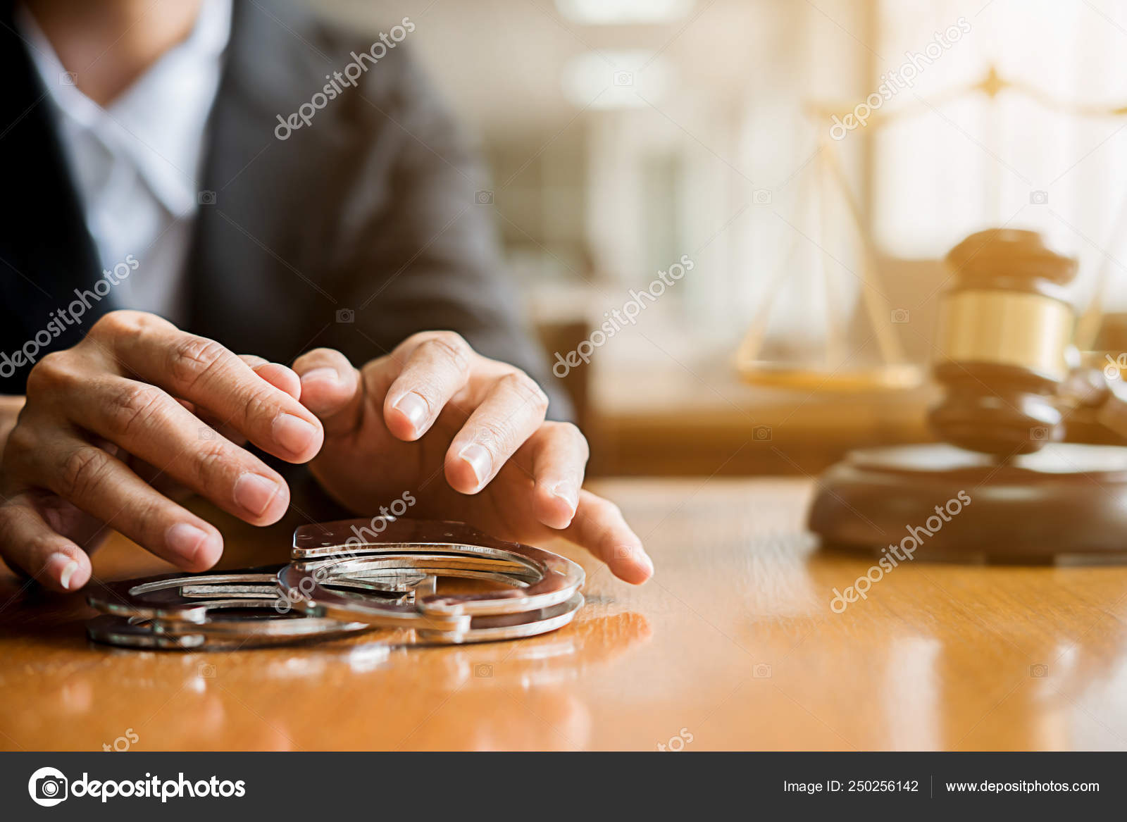 Judge gavel, key and handcuffs on table with Justice lawyers hav Stock ...