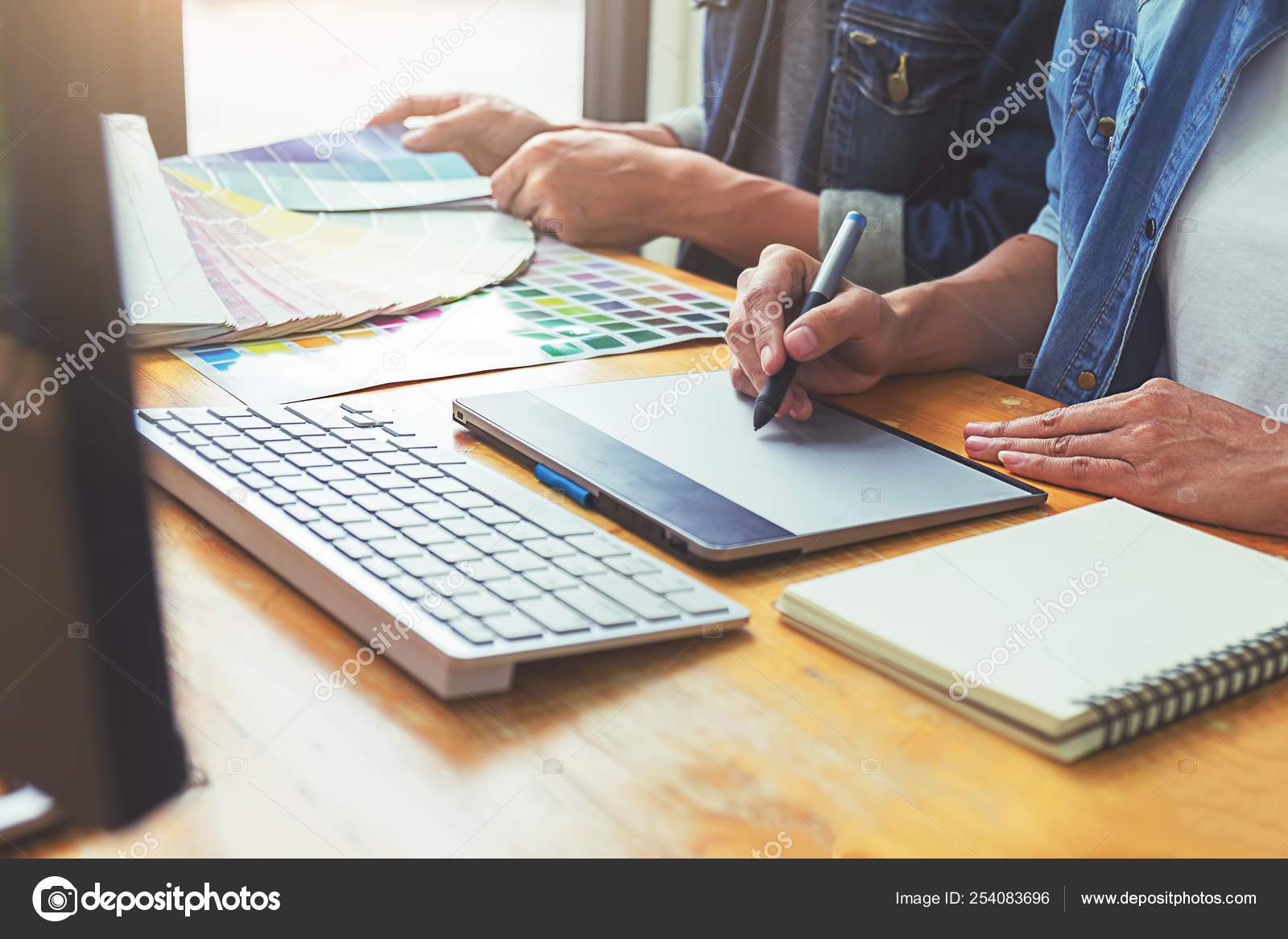 Graphic design with color swatches and tablet on a desk. Graphic Stock ...
