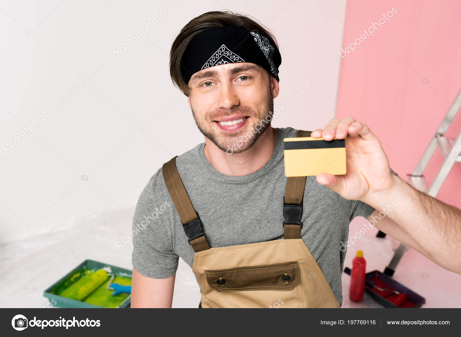 Smiling Man Headband Working Overall Holding Credit Card — Stock Photo ...