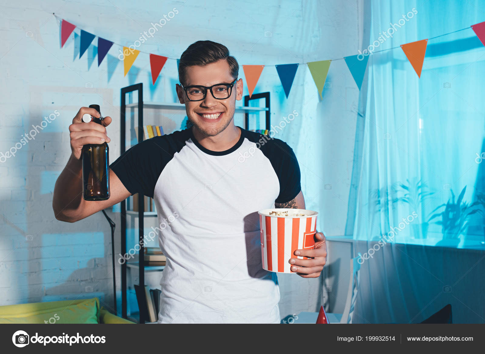 Smiling Young Man Holding Popcorn Box Beer Bottle Home Party Stock ...