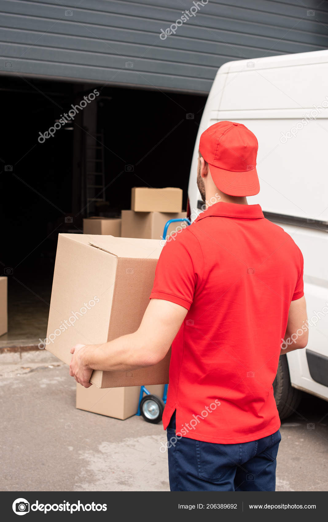 Back View Delivery Man Red Uniform Carrying Cargo — Stock Photo ...