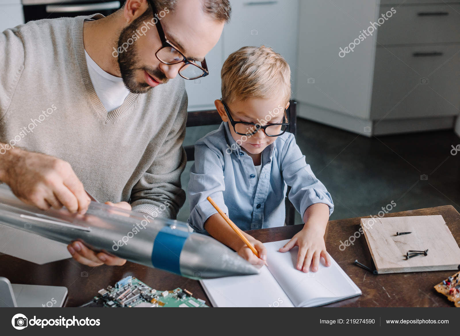 Father Son Testing Rocket Model Home — Stock Photo © IgorVetushko ...