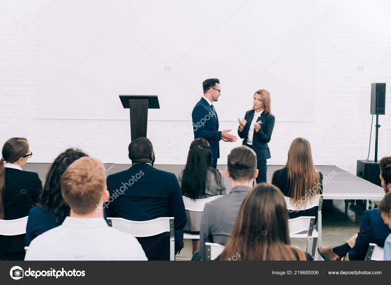 Colleagues Talking Front Multicultural Audience Seminar Conference Hall ...