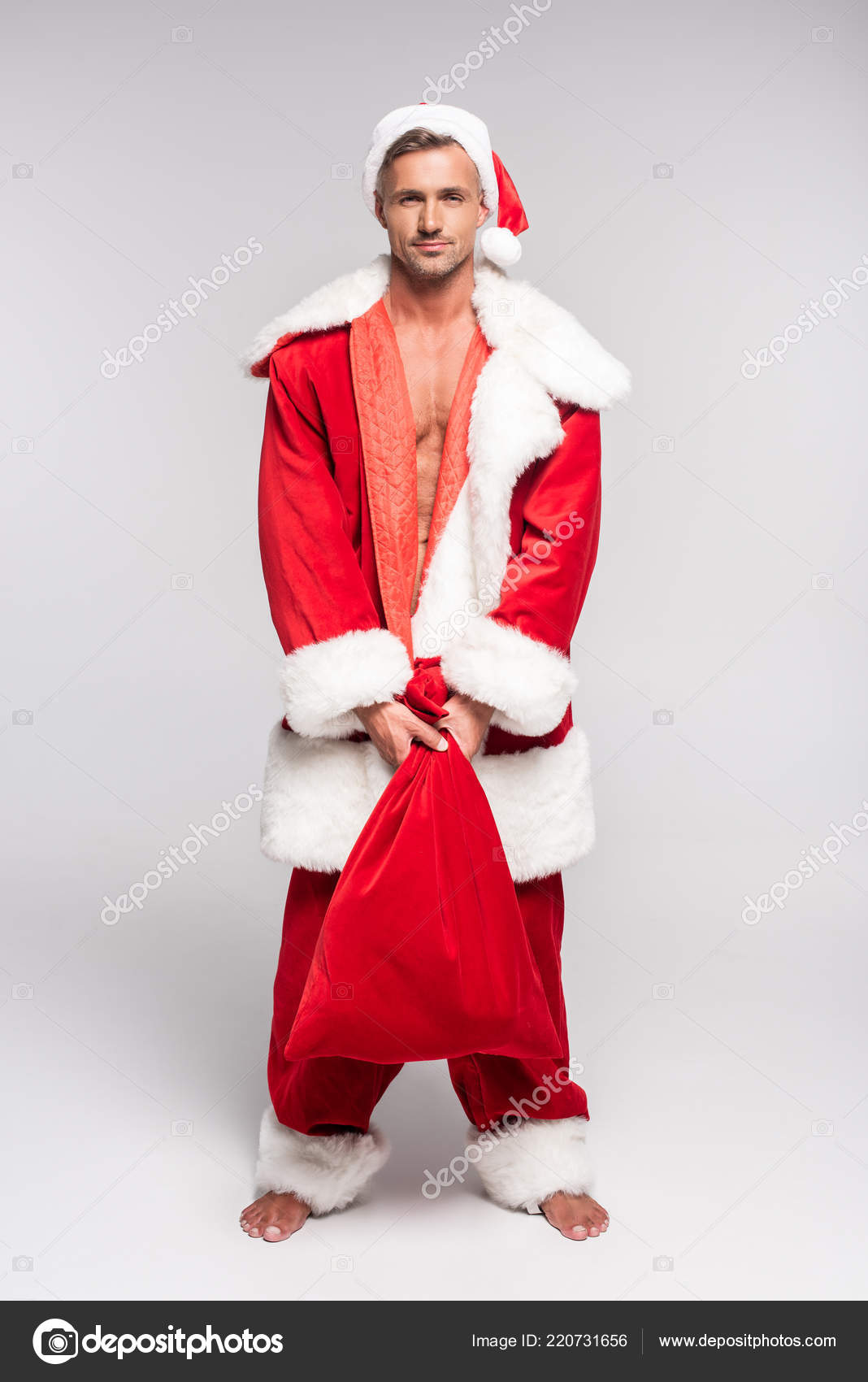 Full Length View Handsome Barefoot Man Santa Costume Holding Red ... Full Length View Handsome Barefoot Man Santa Costume Holding Red ...