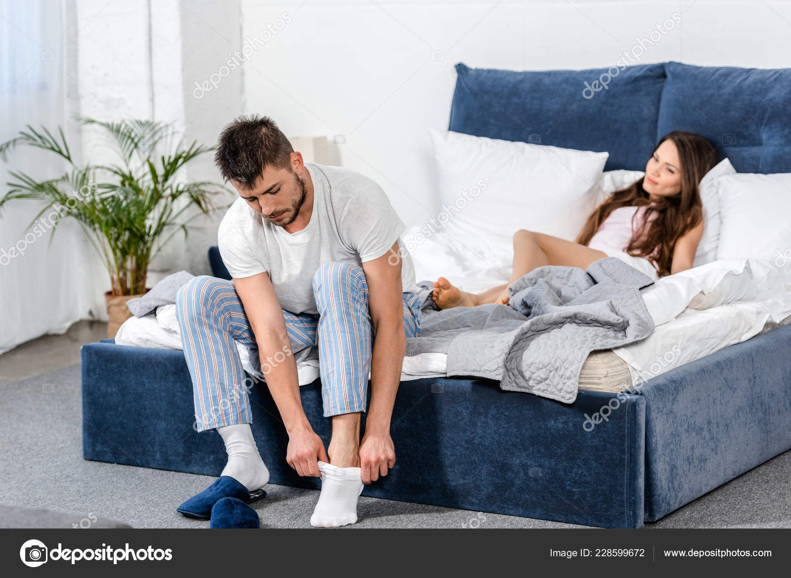 Girlfriend Lying Bed Boyfriend Pajamas Wearing Socks Bedroom — Stock ...