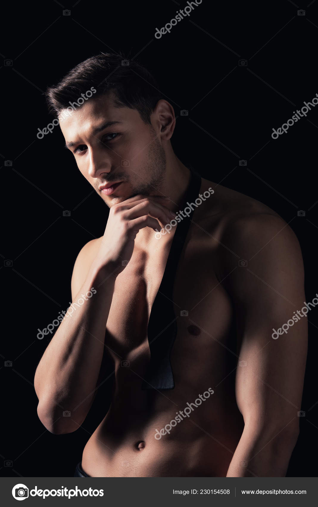 Shirtless Man Posing Looking Camera Touching Chin Isolated Black — Free ...