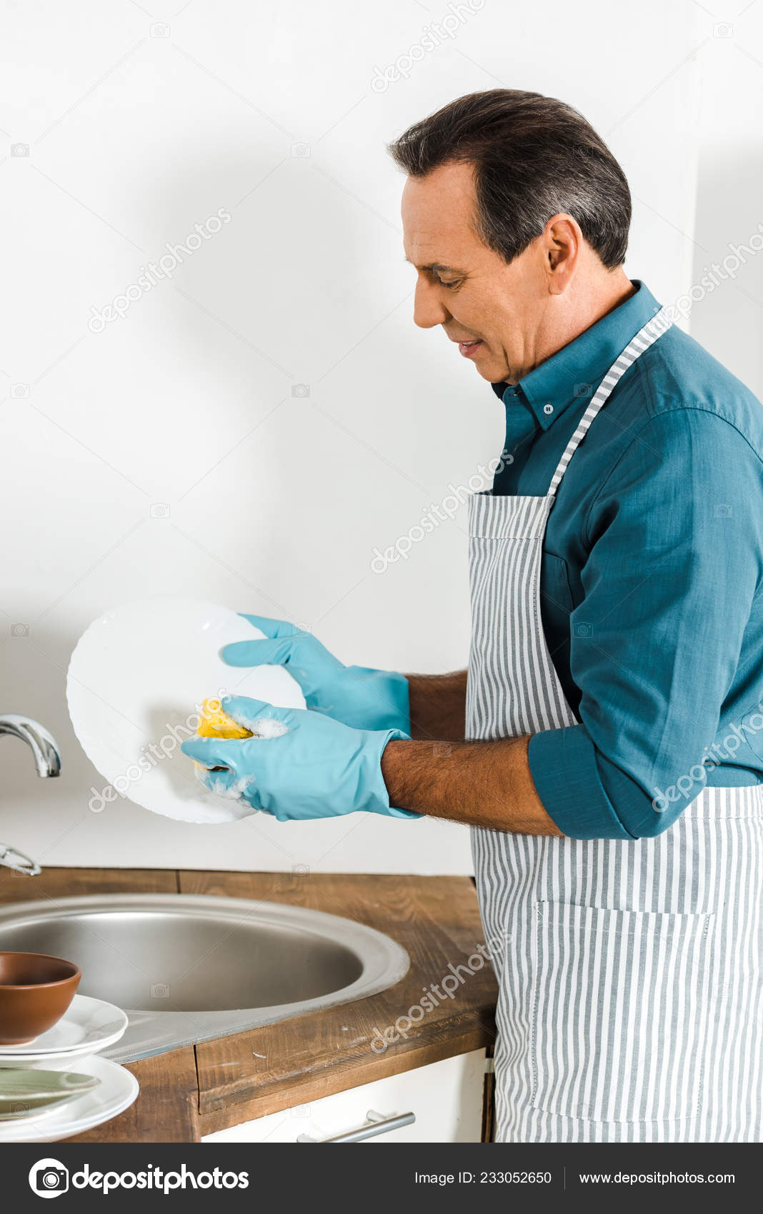 Man Washing The Dishes