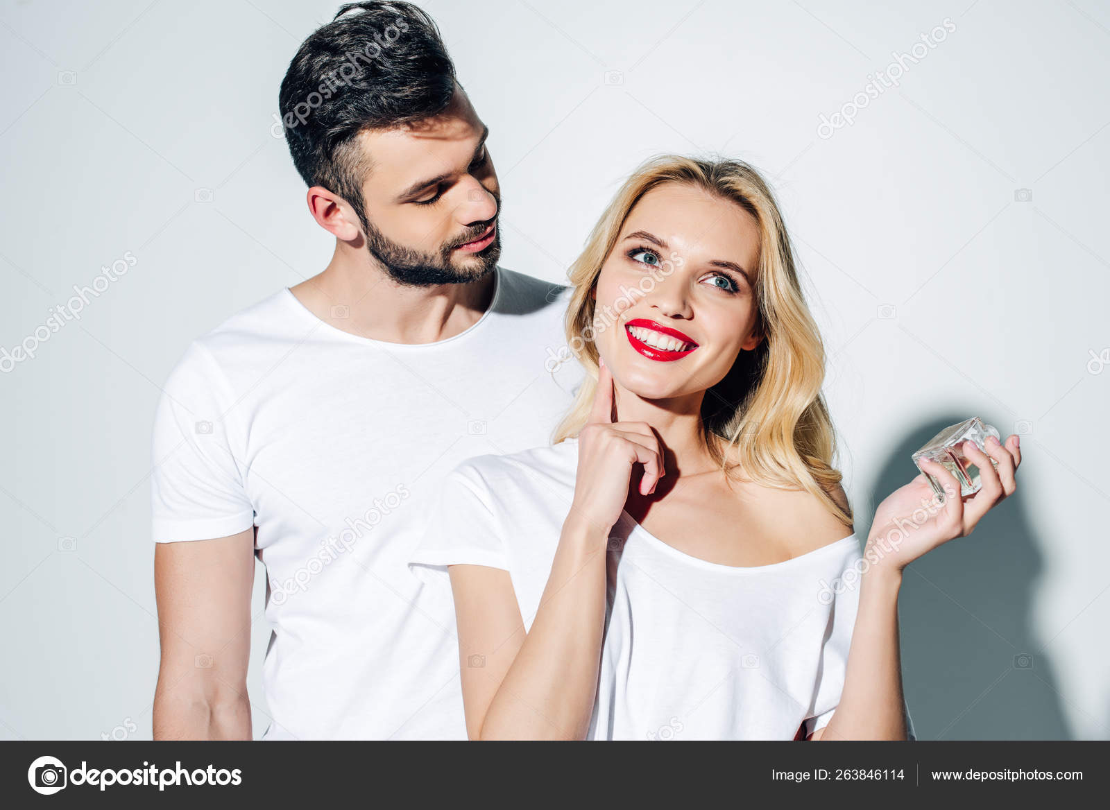 Handsome Man Looking Cheerful Blonde Girl Applying Perfume White ...
