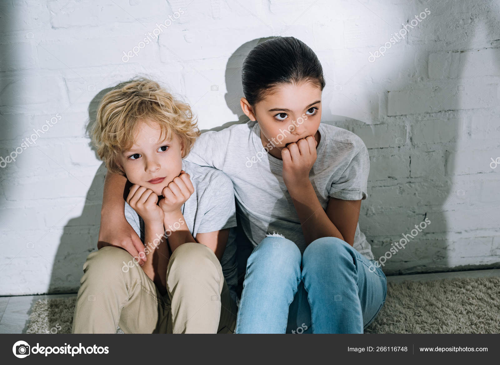 Scared Sister Embracing Brother While Sitting Carpet — Stock Photo ...