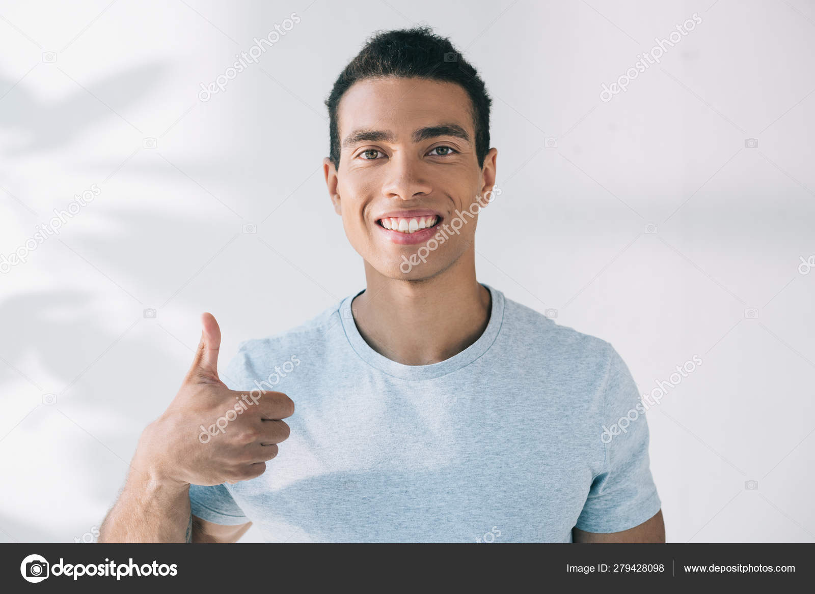Handsome Man Showing Thumb Smiling Looking Camera — Stock Photo © IgorVetushko #279428098