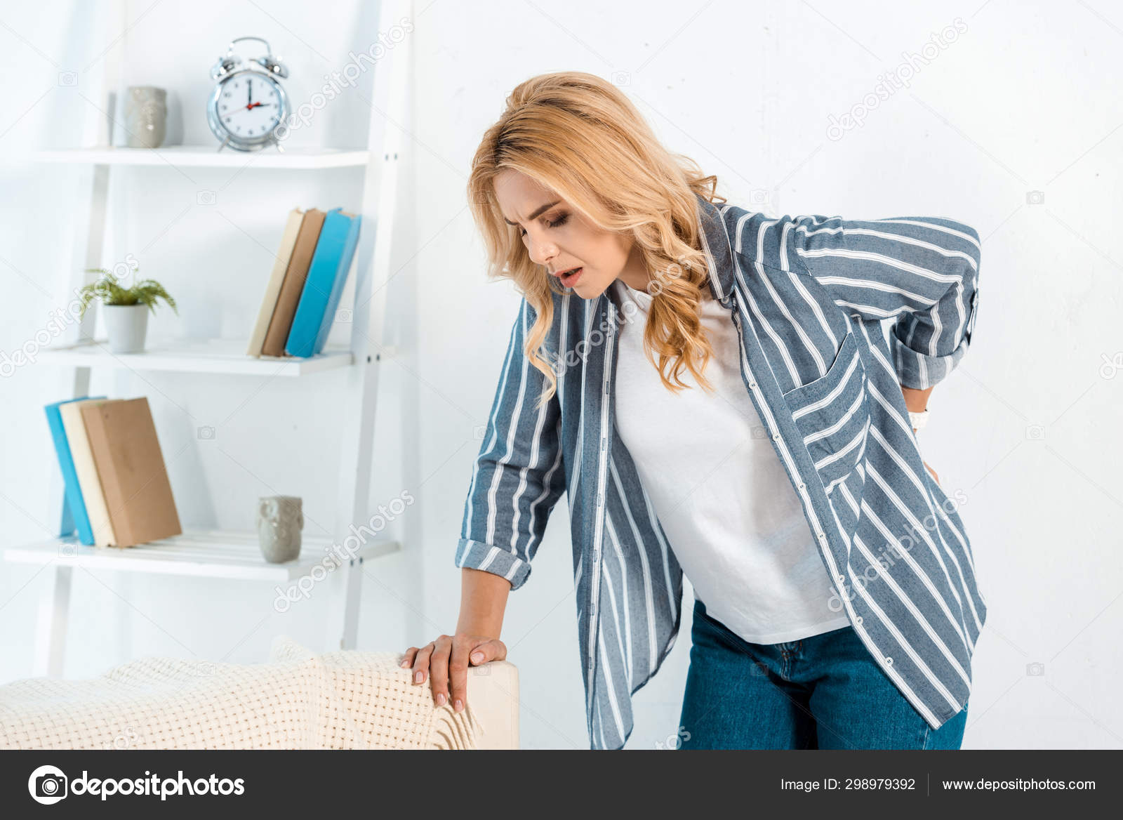 Attractive Woman Touching Back While Suffering Pain Stock Photo by ...