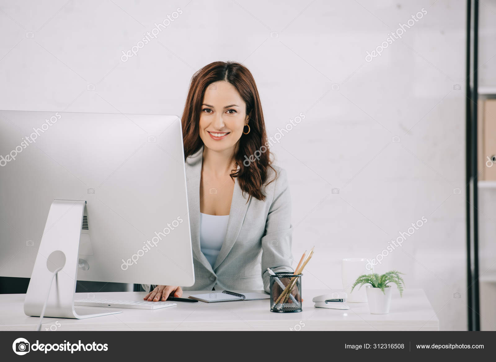Attractive Smiling Secretary Looking Camera While Sitting Workplace ...