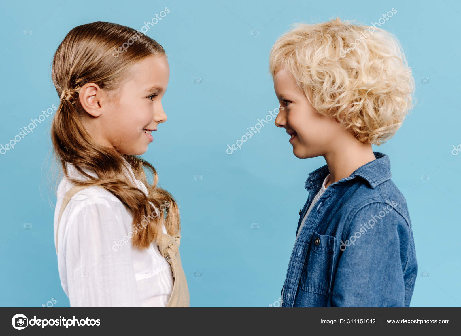 Side View Smiling Cute Kids Looking Each Other Isolated Blue Stock ...