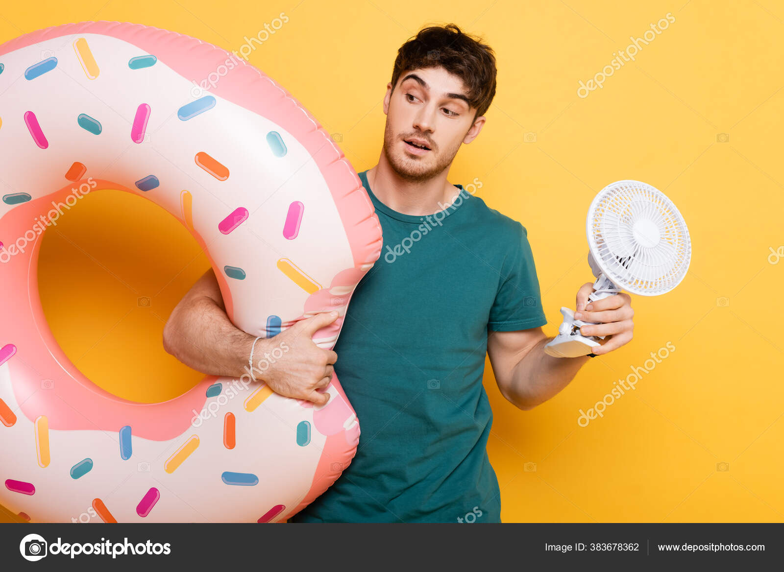 Surprised Man Holding Inflatable Donut Little Electric Fan Yellow ...