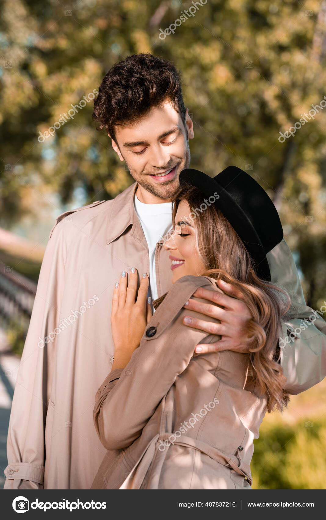 Man Trench Coat Hugging Woman Hat — Stock Photo © IgorVetushko #407837216