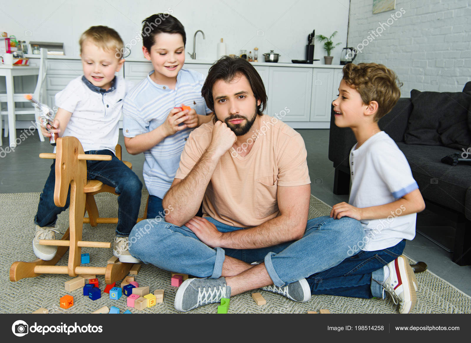 Stressed Father Sitting Floor Sons Playing Room — Stock Photo ...