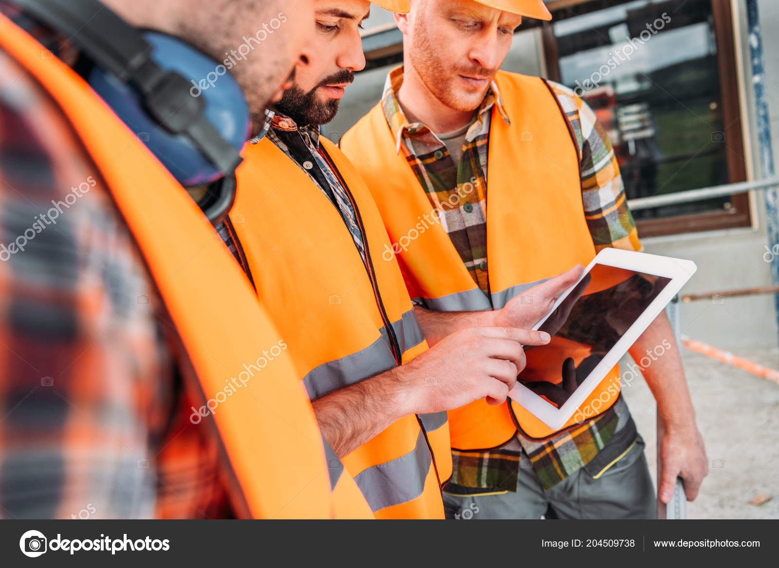 Close Shot Group Builders Using Digital Tablet Construction Site Stock ...