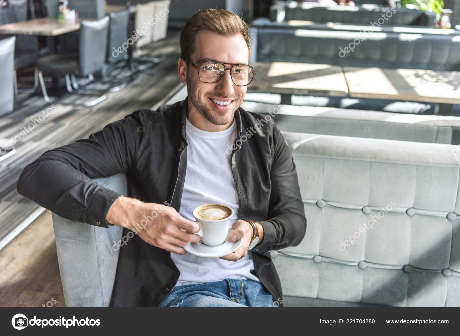 Smiling Young Man Cup Coffee Sitting Cafe Looking Camera — Free Stock ...