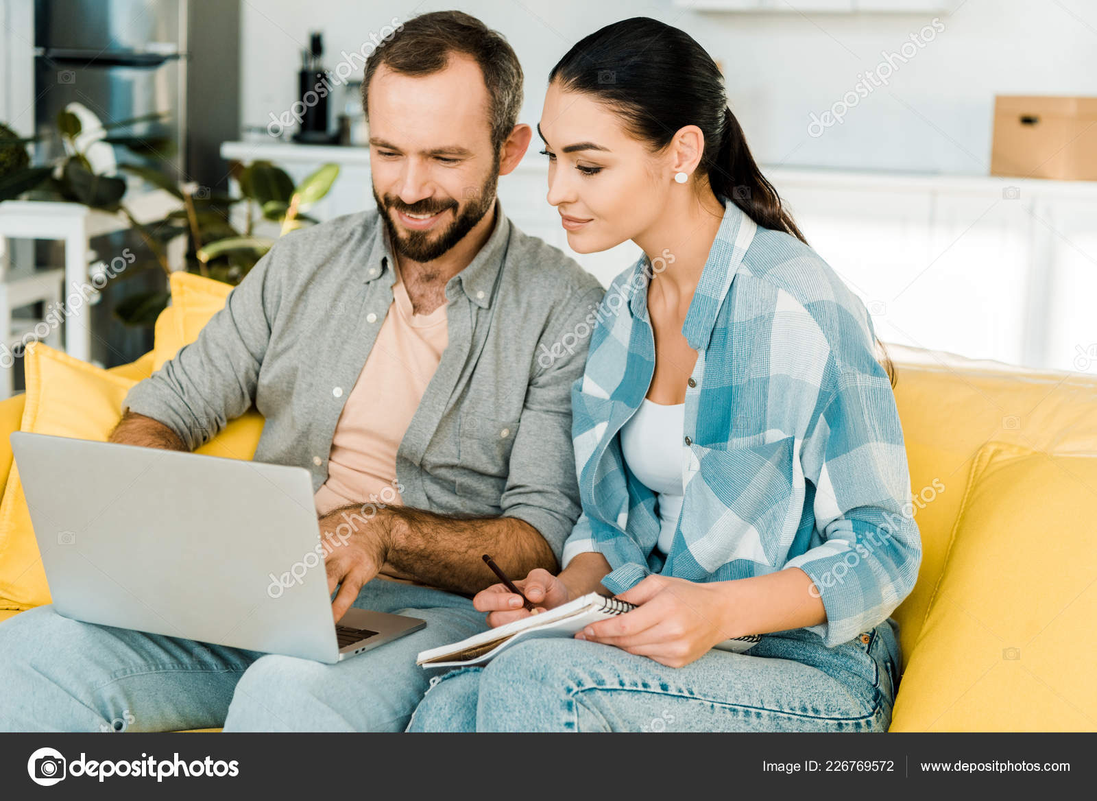 Beautiful Couple Sitting Couch Using Laptop Home Stock Photo by ...