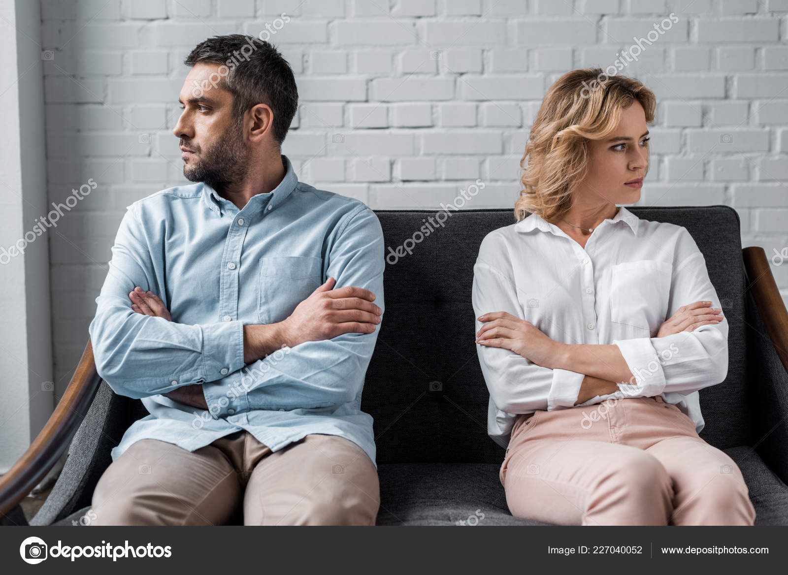Mad Couple Sitting Couch Quarrel Looking Away Stock Photo by ...