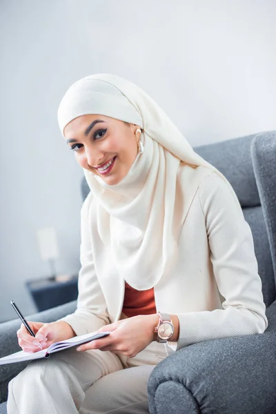 Thoughtful Muslim Woman Sitting Bed Writing Notebook Stock Photo by ...