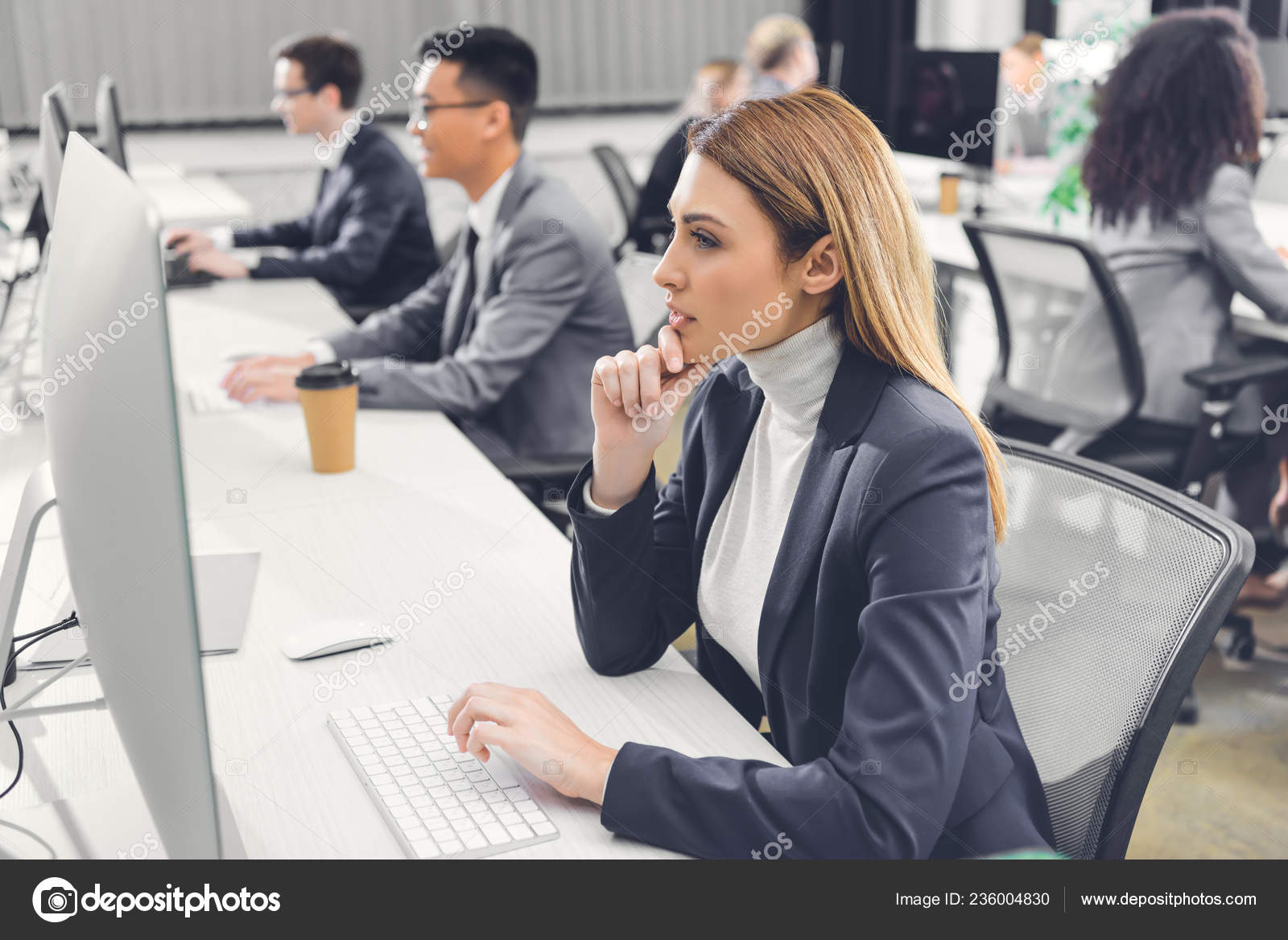 Concentrated Young Businesswoman Using Desktop Computer While Working ...