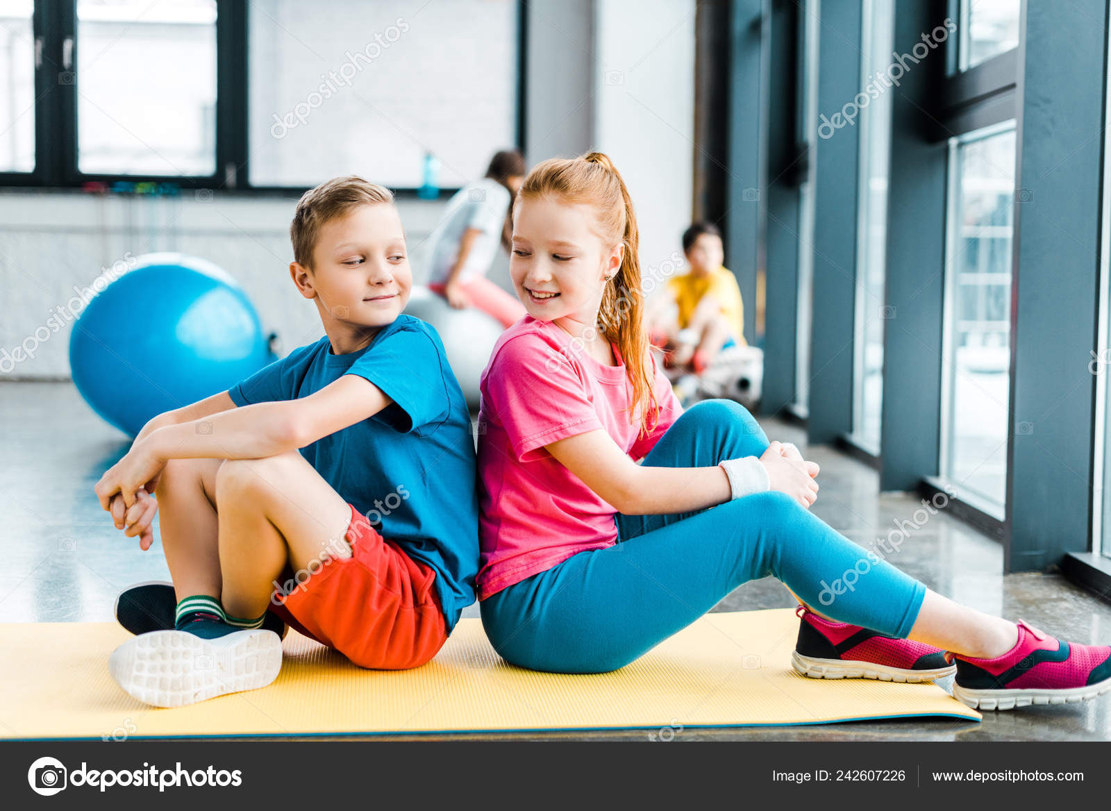 Kids sitting back to back | Two Kids Sitting Back Back Fitness Mat ...