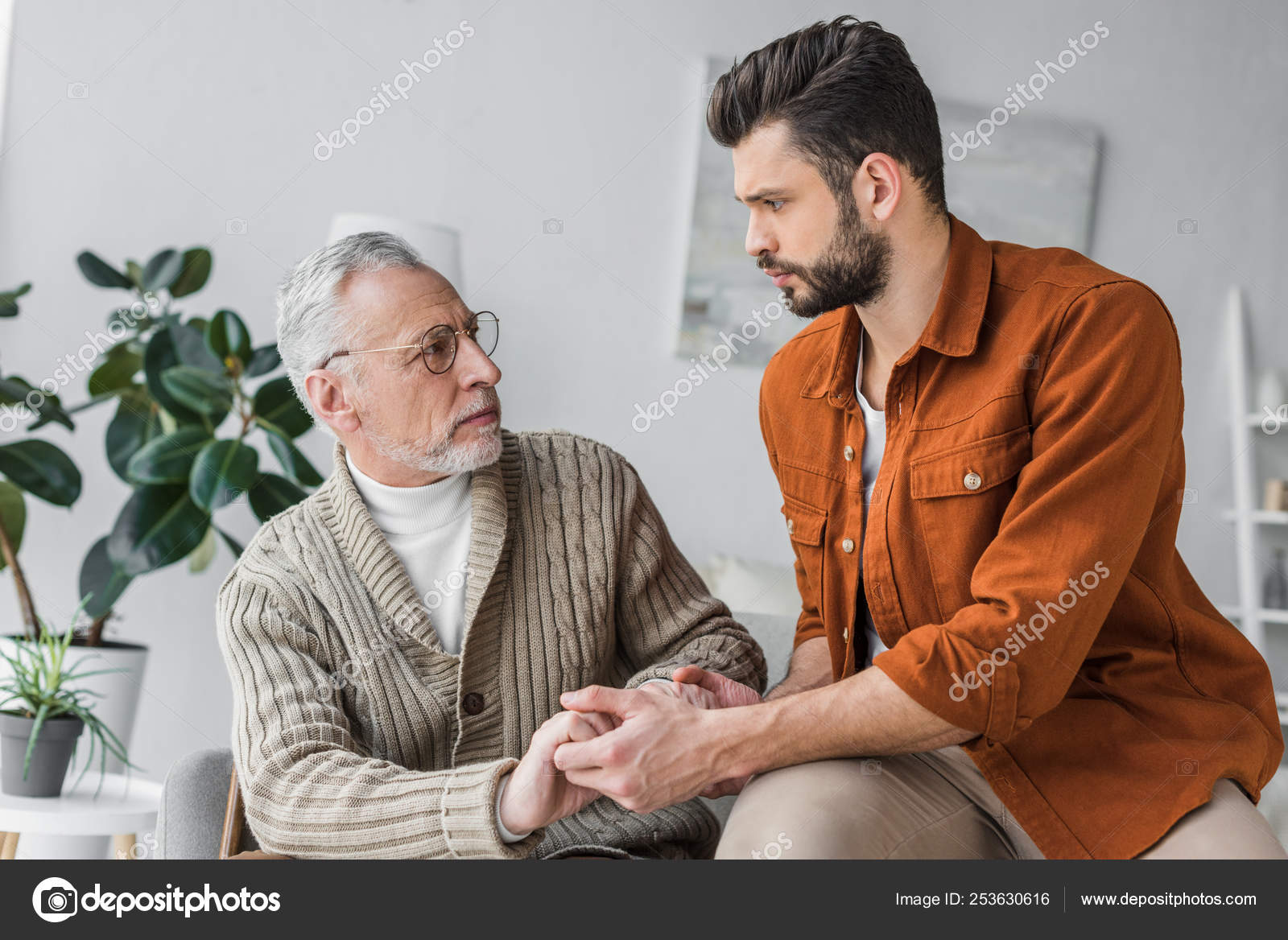 Sad Senior Father Glasses Holding Hands Handsome Son Home — Stock Photo ...