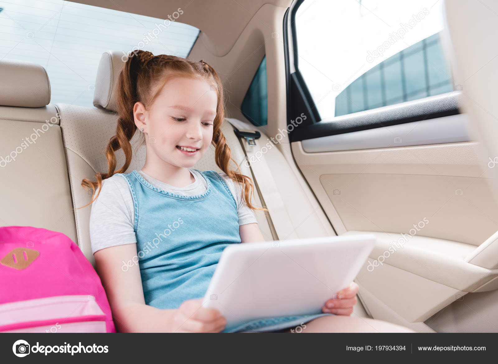 Portrait Smiling Child Using Tablet While Sitting Car Stock Photo by ...