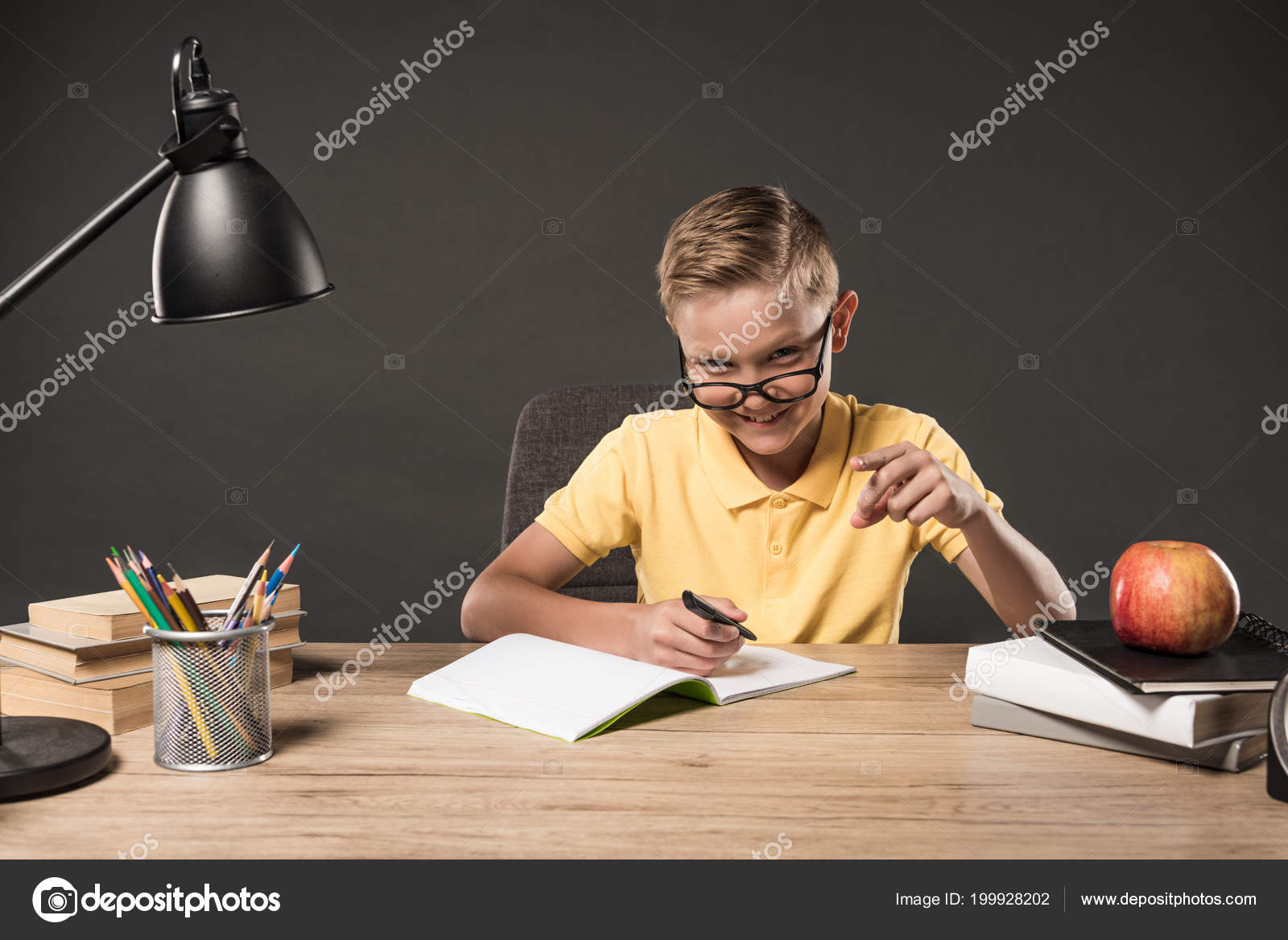 Happy Schoolboy Eyeglass Pointing Finger Doing Homework Table Lamp ...