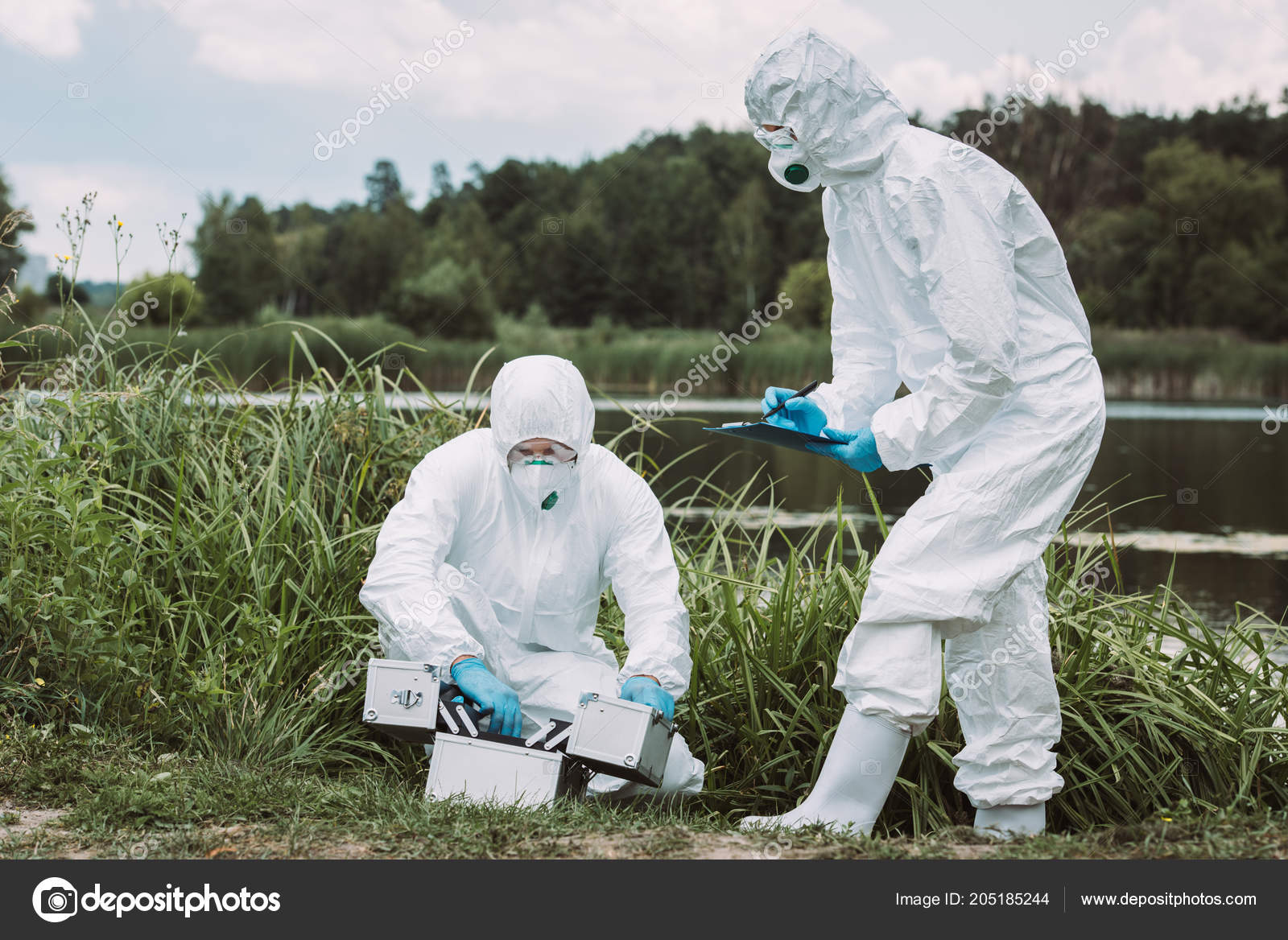 Male Scientist Protective Mask Suit Opening Working Suitcase While His ...