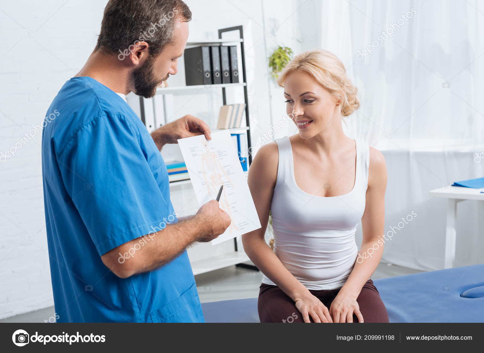 Physiotherapist Showing Human Body Scheme Woman Massage Table Hospital ...