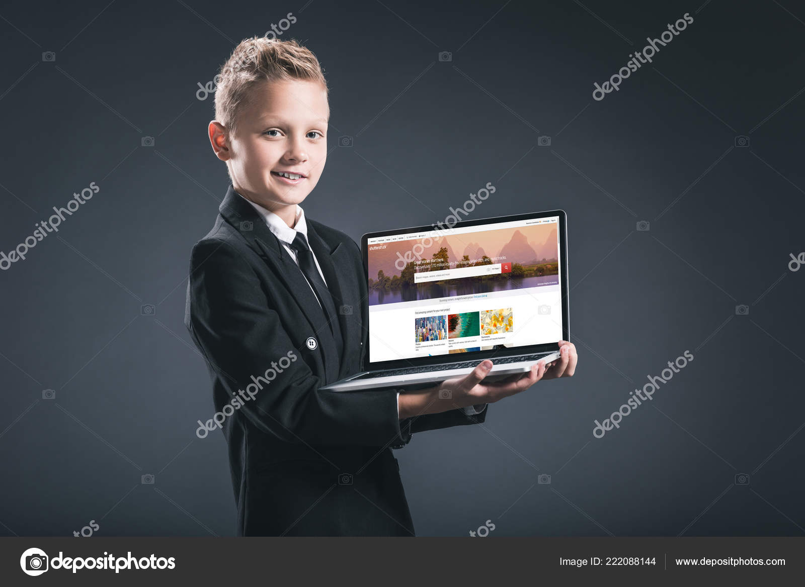 Smiling Boy Businessman Suit Showing Laptop Shutterstock Website Screen ...