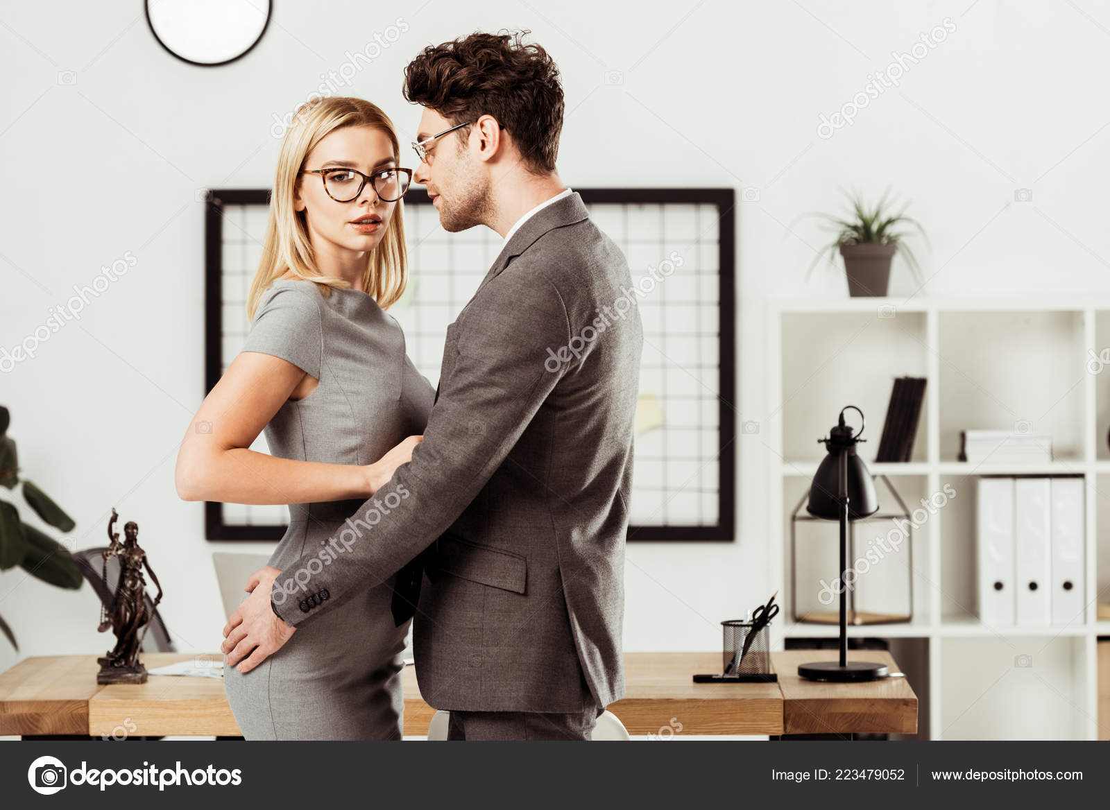 Young Lawyers Hugging Each Other While Standing Office Flirt Office ...