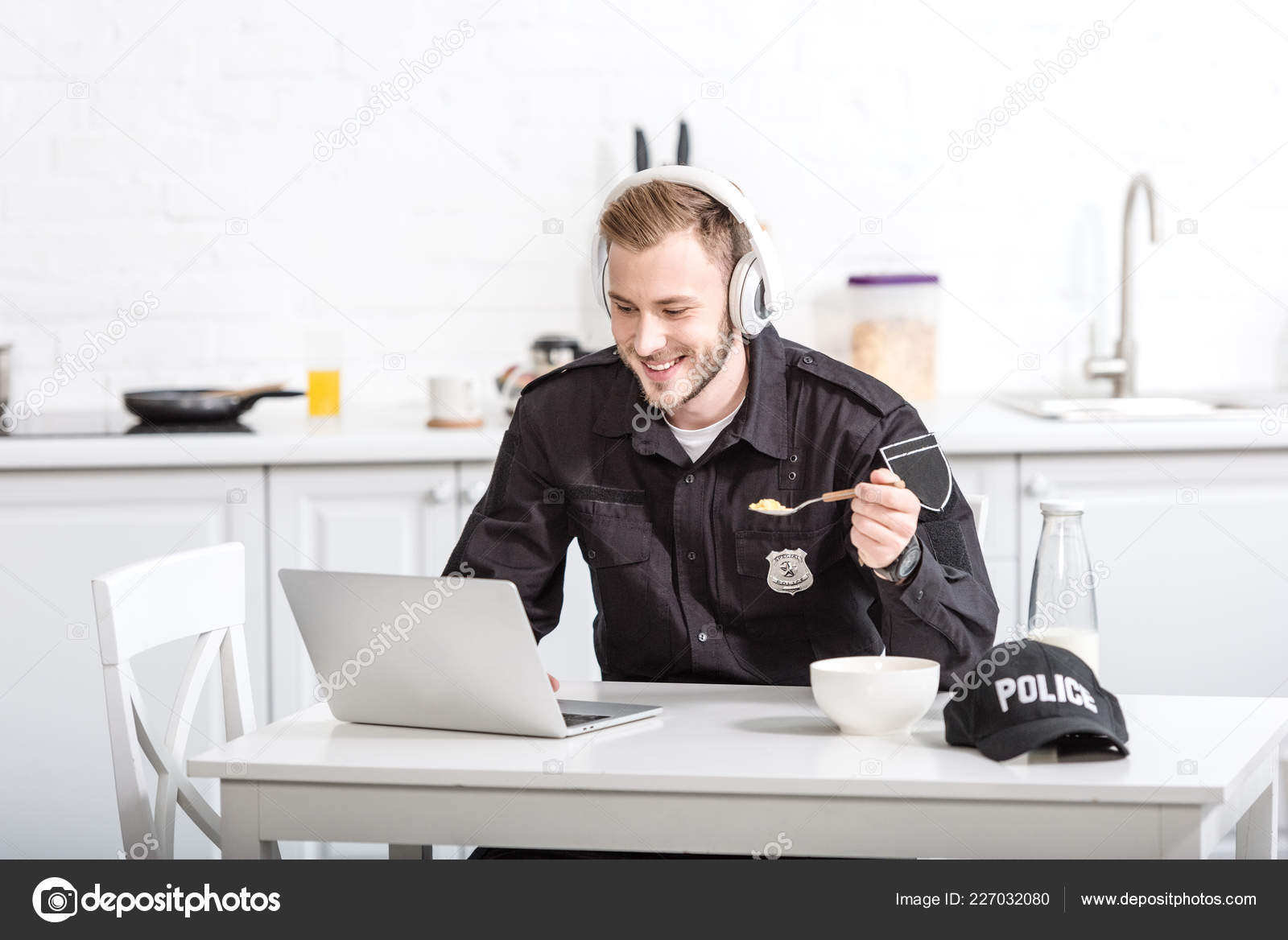 Handsome Police Officer Eating Cornflakes Using Laptop Kitchen — Free ...