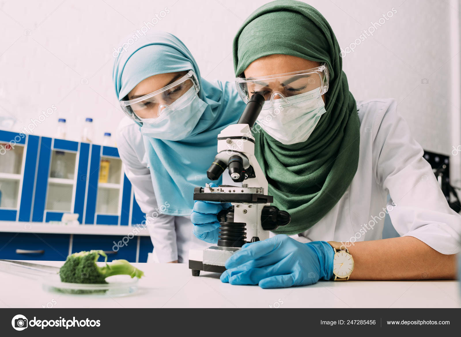 Female Muslim Scientists Using Microscope Experiment Broccoli Chemical ...