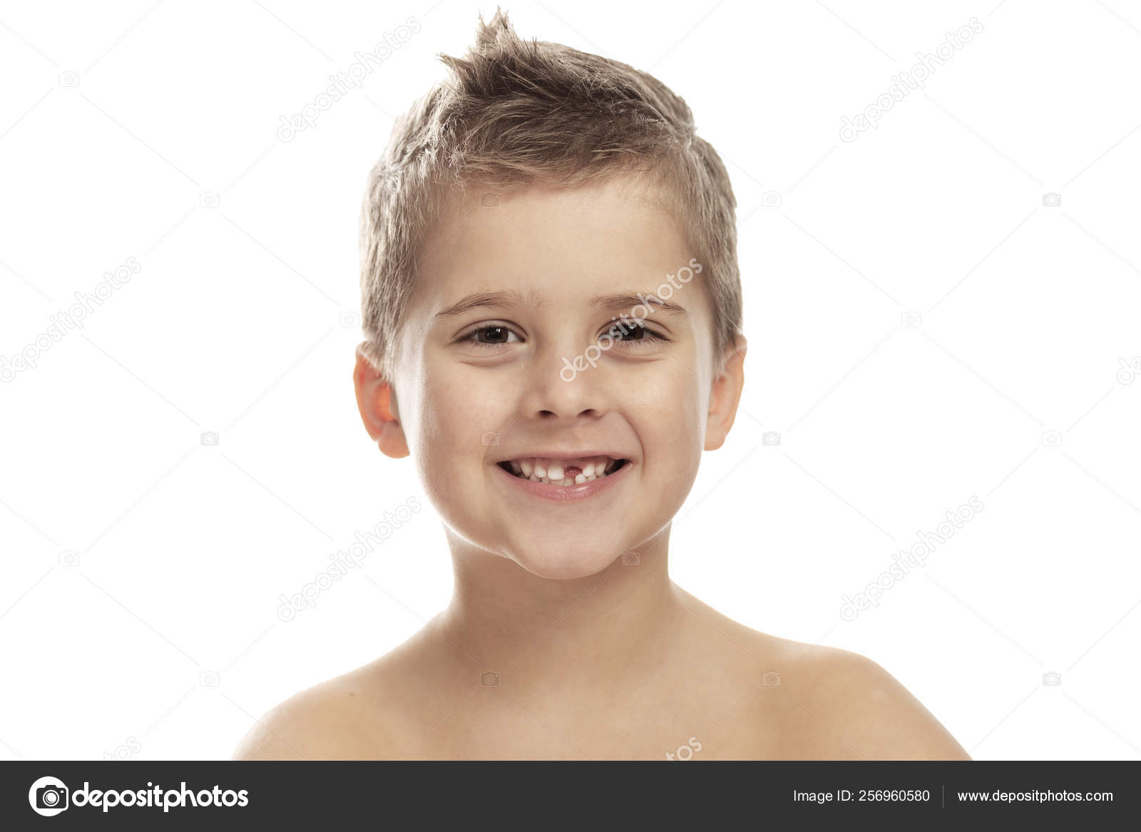 Cute laughing boy without a front tooth. Isolated on a white bac ...