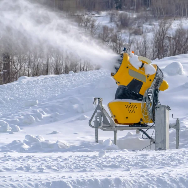 Snow cannon at work on a sunny winter day in Utah - Stock Image ...