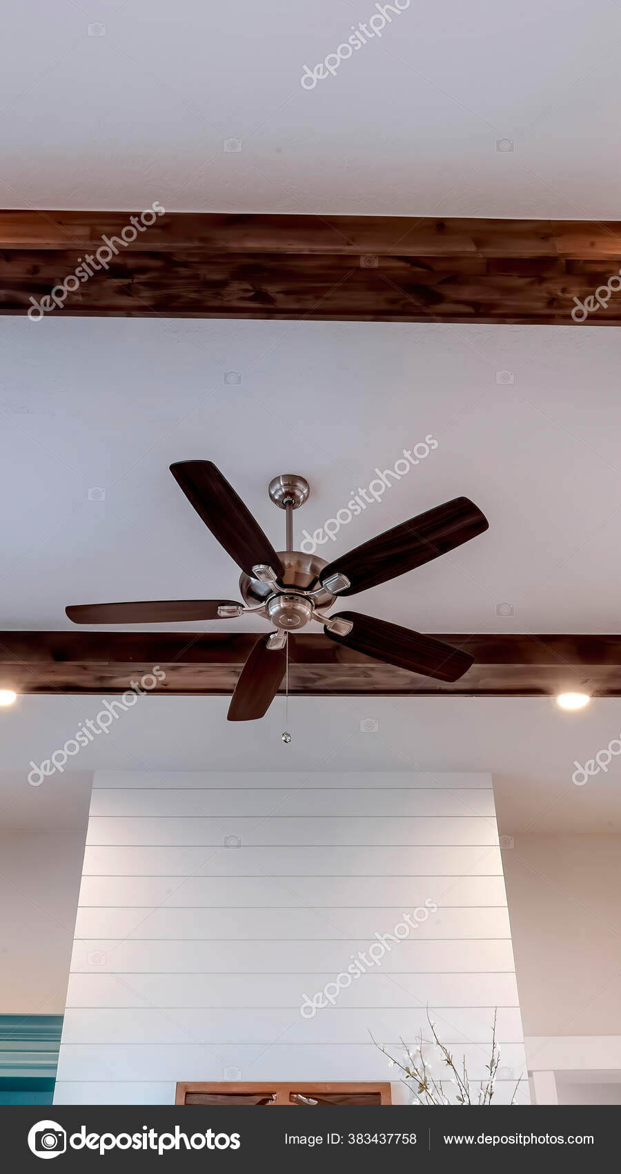Vertical Ceiling fan with lights between decorative wood beams inside ...